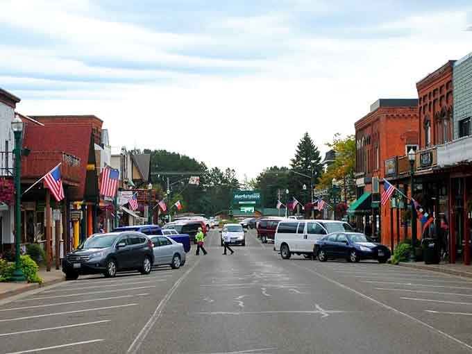 Flags wave proudly along streets where neighbors still stop to chat on their daily errands.