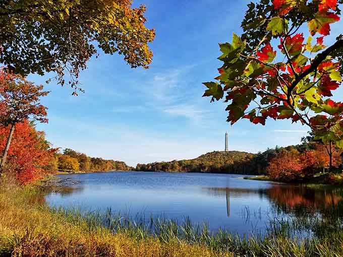 Framed by blazing autumn leaves, this peaceful lake view proves nature's the best interior decorator around.