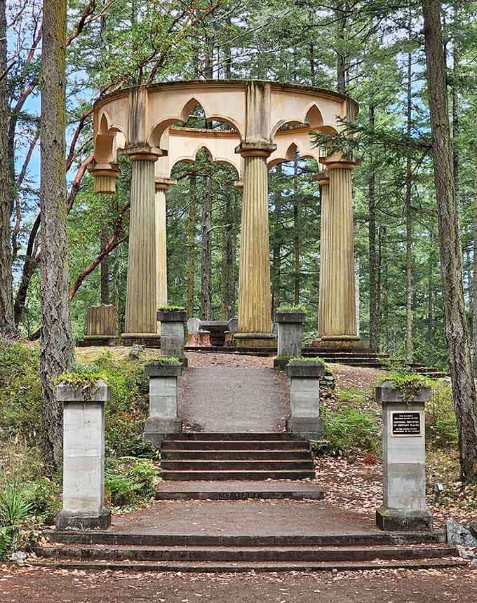Rising from the forest floor like a Roman emperor's forgotten gazebo, this stone mausoleum is the Pacific Northwest's most unexpected architectural surprise.