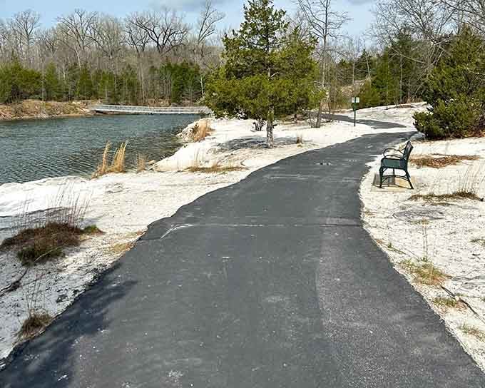 A smooth paved path curves along Klondike's brilliant white shoreline, with a welcoming bench practically whispering, "Sit down, you've earned this view."