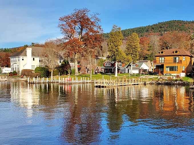Lake George's waterfront houses reflect perfectly in the calm water, like a Norman Rockwell painting come to life.