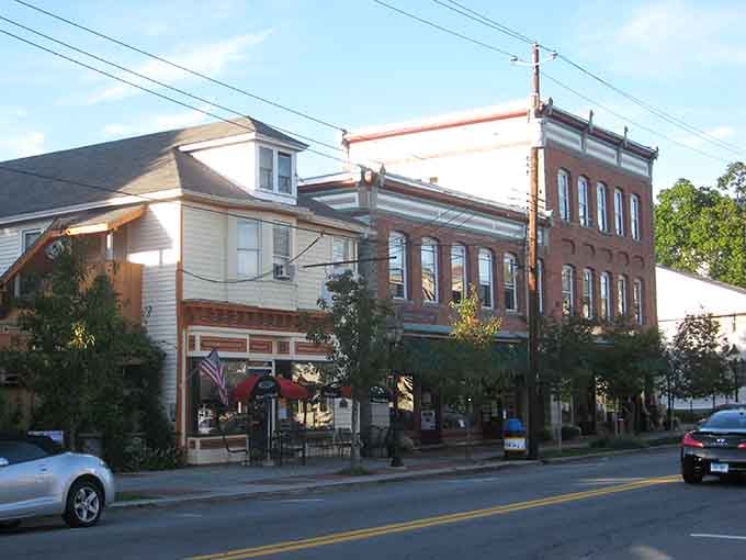 Golden hour hits Milford's mixed architecture just right, making even the corner caf&eacute; look like a painting worth framing.