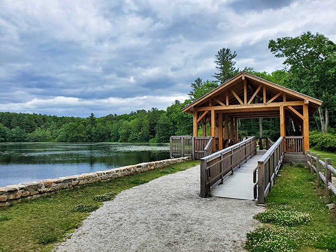 A covered bridge frames this peaceful pond where time slows down and your shoulders finally remember how to relax.
