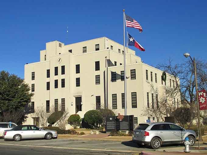 Mount Pleasant's Art Deco courthouse gleams under a crisp blue sky, flying the Texas flag like it means every word.