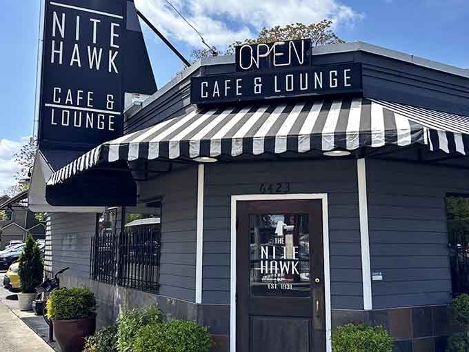 That sharp black and white striped awning tells you everything you need to know — the Nite Hawk means serious, stylish business.