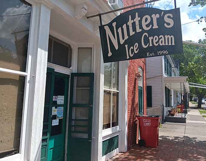 Nutter's bold hanging sign over a historic brick corner says everything you need to know about small-town charm.