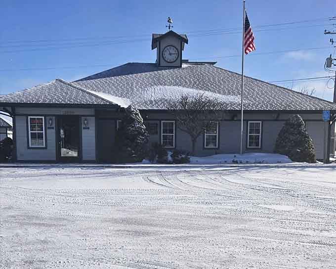 Snow-dusted and standing tall, the Old Depot's clock tower keeps perfect time in northern Michigan's frozen landscape.