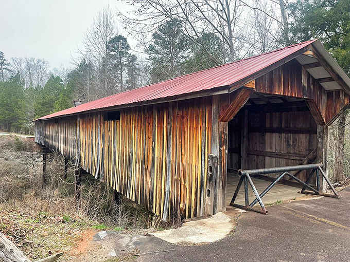That bold red roof against warm wooden walls says this bridge dressed up and meant it.