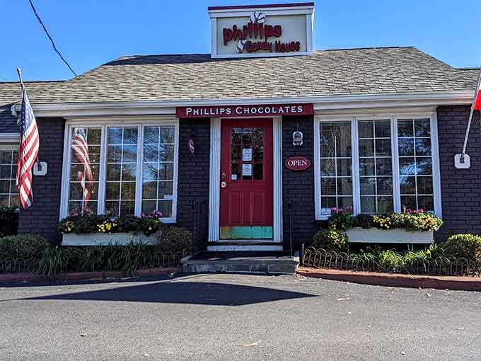 That cheerful red door and tidy window boxes make Phillips Chocolates look like the friendliest spot on Morrissey Boulevard.