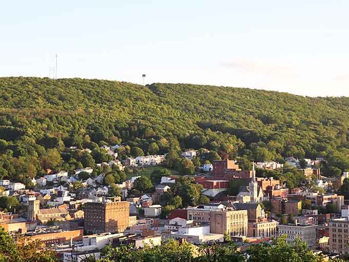 Golden light spilling over Pottsville's rooftops and church steeples, this valley view is pure Pennsylvania magic.