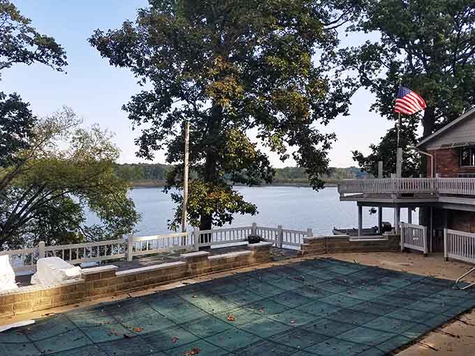 Raccoon Lake spreads wide and calm behind the lodge, the kind of view that makes your shoulders finally drop.