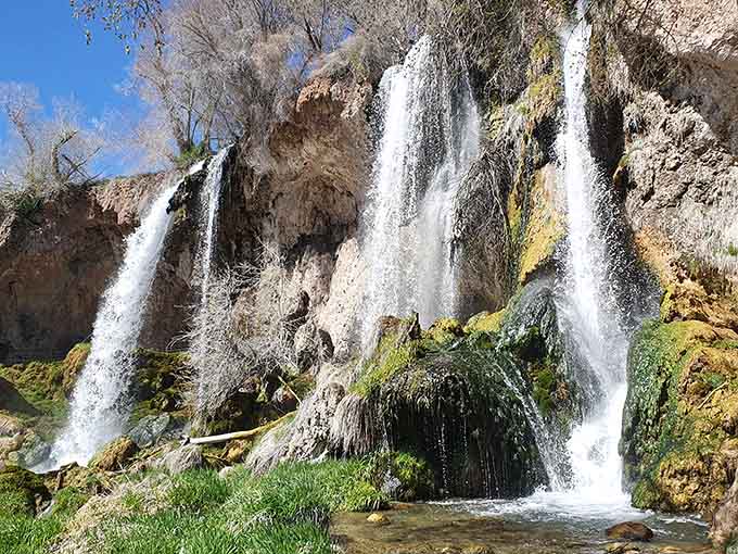 Three waterfalls tumbling side by side over vivid green moss &mdash; Rifle Falls looks like Colorado borrowed a page from Hawaii.
