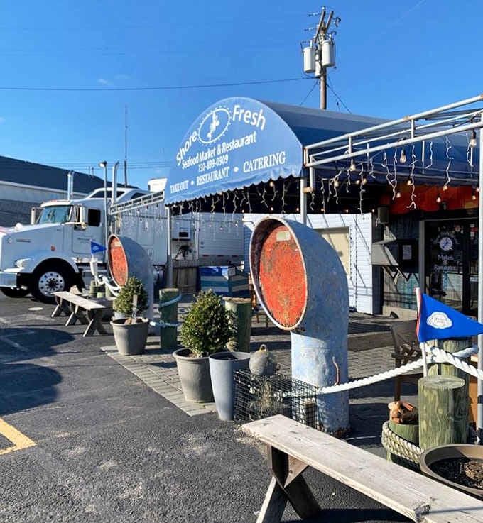 Rusty pipe sculptures and rope accents give Shore Fresh an unmistakably salty, dockside personality that no decorator could fake.