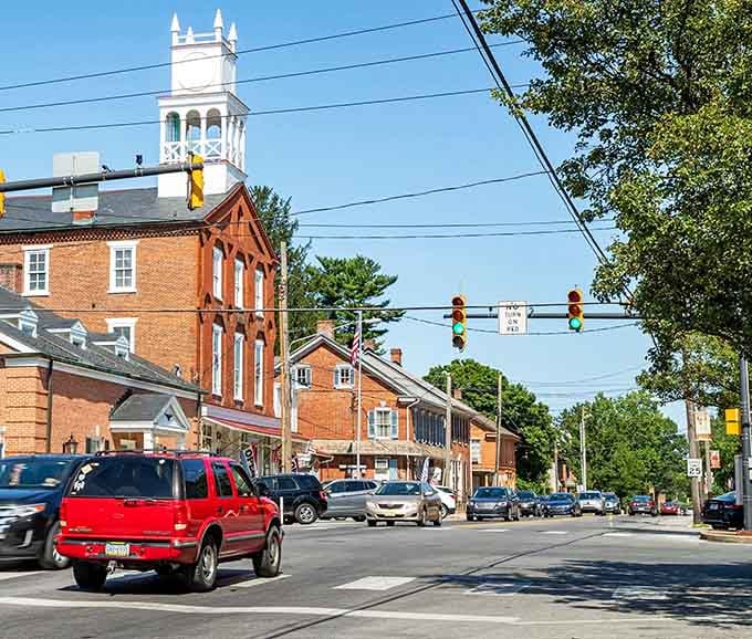 That white tower rises above the brick buildings like a lighthouse guiding you to small-town charm.
