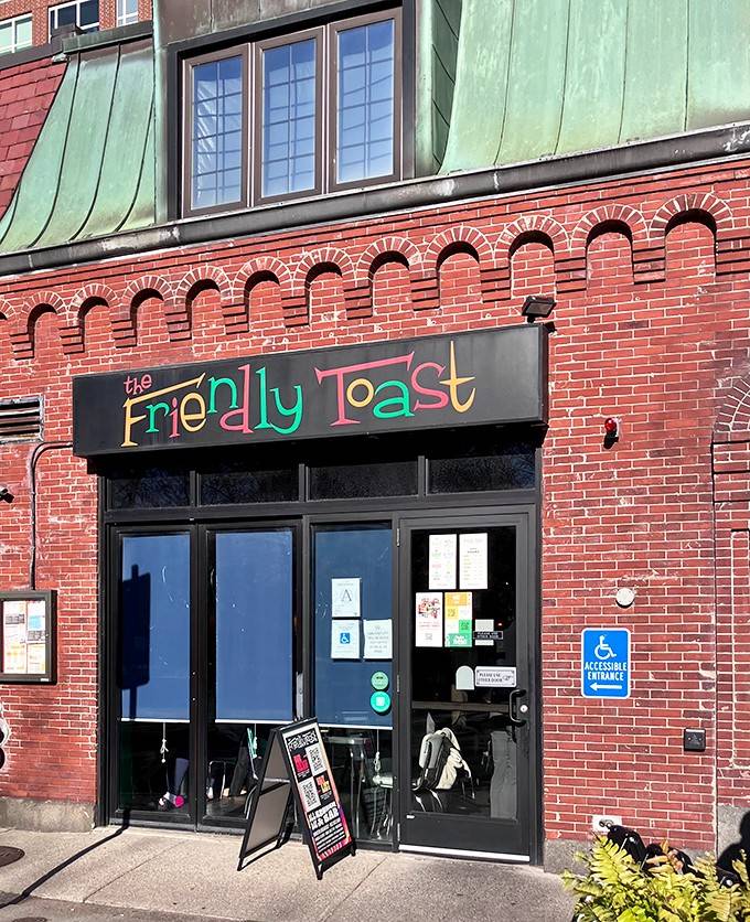 That rainbow-lettered sign on brick tells you breakfast rules don't apply here, and neither does boring decor.