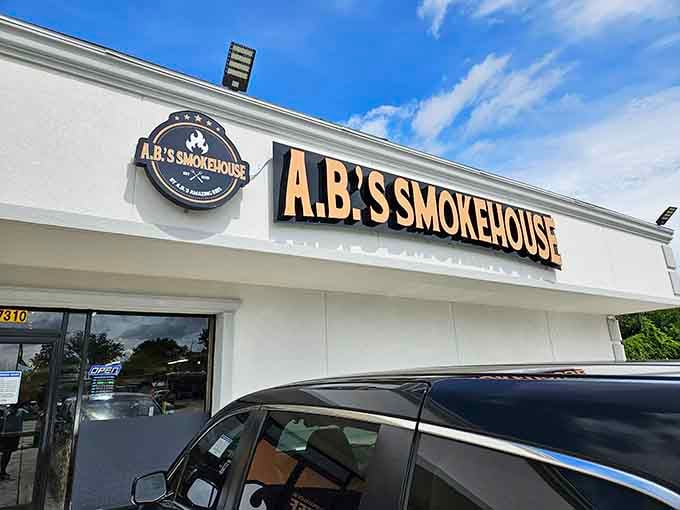 Bold lettering against crisp white siding announces this smokehouse with the confidence of a place that delivers quality.