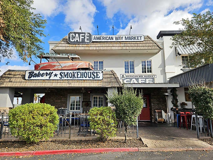 The vintage market signage and shaded patio seating create that perfect blend of old-school charm and modern comfort dining.