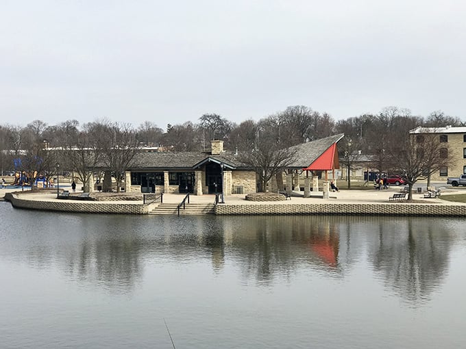 That red-roofed pavilion reflected in the still Fox River water is the kind of scene that makes you put your phone away and just look.