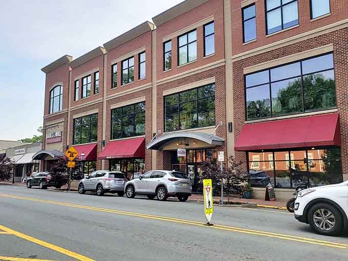 Bold red awnings and floor-to-ceiling windows give Elon's newer downtown block a polished energy that still feels genuinely welcoming.