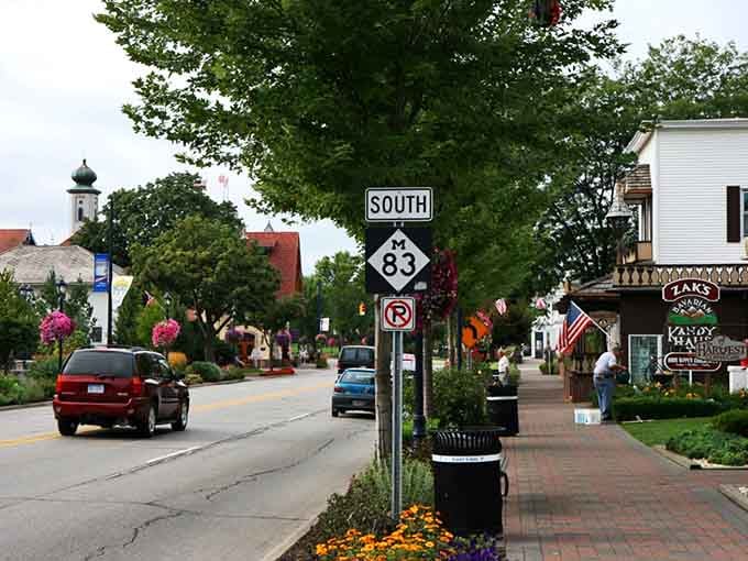 Flower baskets, Bavarian architecture, and a road sign pointing south: Frankenmuth's main street is cheerful enough to lift anyone's spirits.
