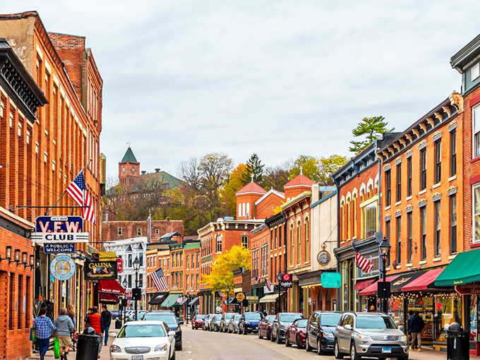 Galena's hillside streets cascade with colorful awnings and flags, creating a scene straight from a Hallmark movie set.