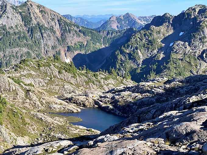 Looking down into this rocky basin feels like discovering a secret the mountains have been keeping for thousands of years.