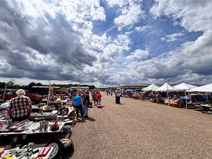 Dramatic clouds rolling over rows of white vendor tents — Hartville's outdoor section is practically begging you to explore it.