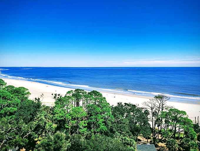 From above, those palmetto canopies shelter a beach so pristine it looks computer-generated, but it's gloriously real.