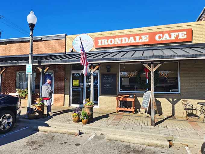 Bright sunshine, a chalkboard menu, and fresh blooms outside confirm this cafe is always ready for company.