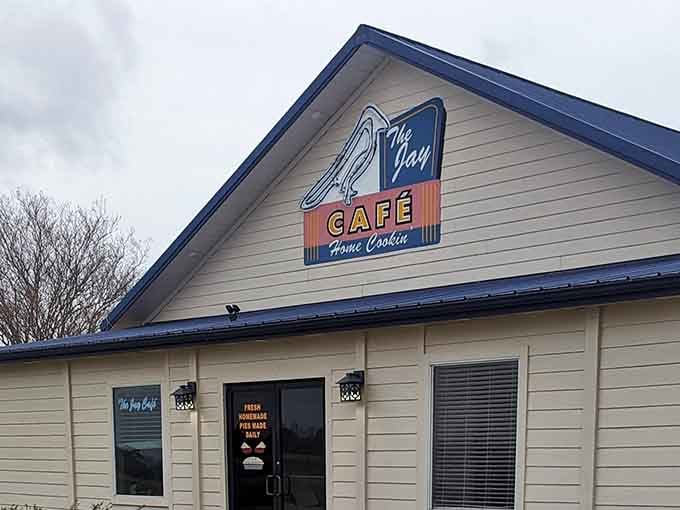 Even on a gray winter day, that cheerful bird logo and bold cafe sign make this place feel like a warm hug waiting inside.
