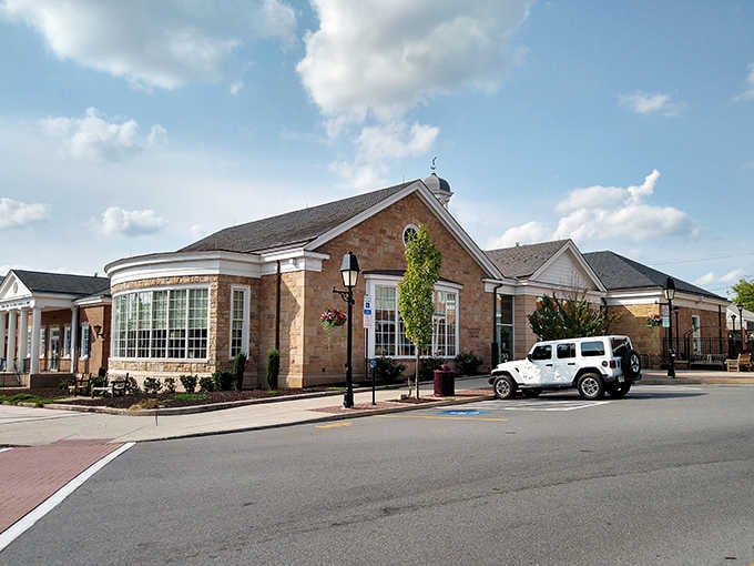 Modern meets historic in this welcoming streetscape where hanging baskets add color to classic brick and stone facades.