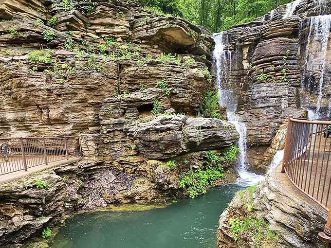 That delicate waterfall spilling down layered limestone is like watching geology write poetry in real time.