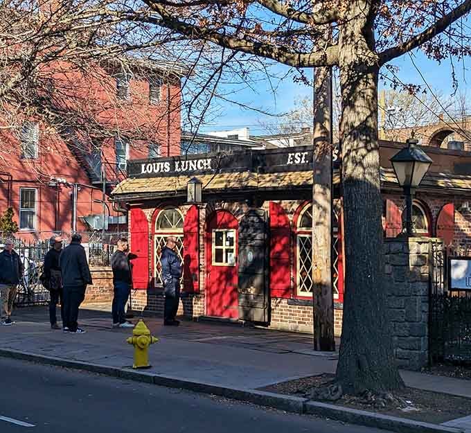 A patient line outside Louis' Lunch on a crisp day proves that great food is always worth the wait.