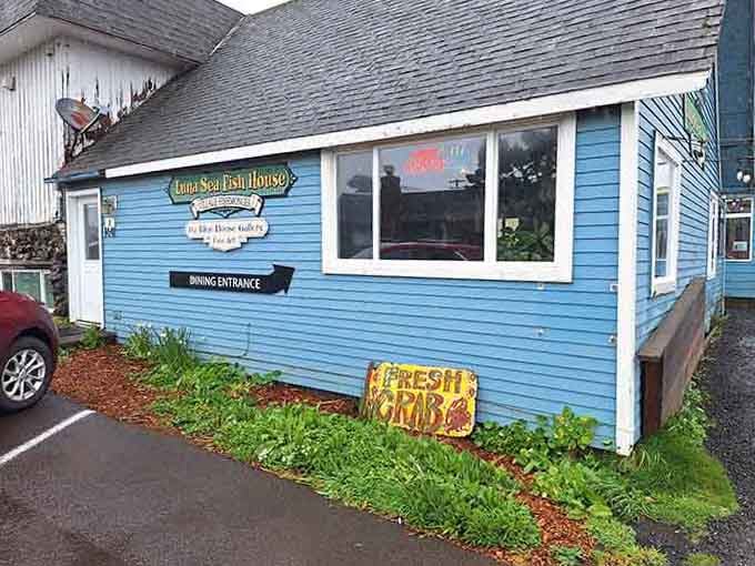 That hand-painted "Fresh Crab" sign leaning against the blue siding is basically an irresistible invitation.