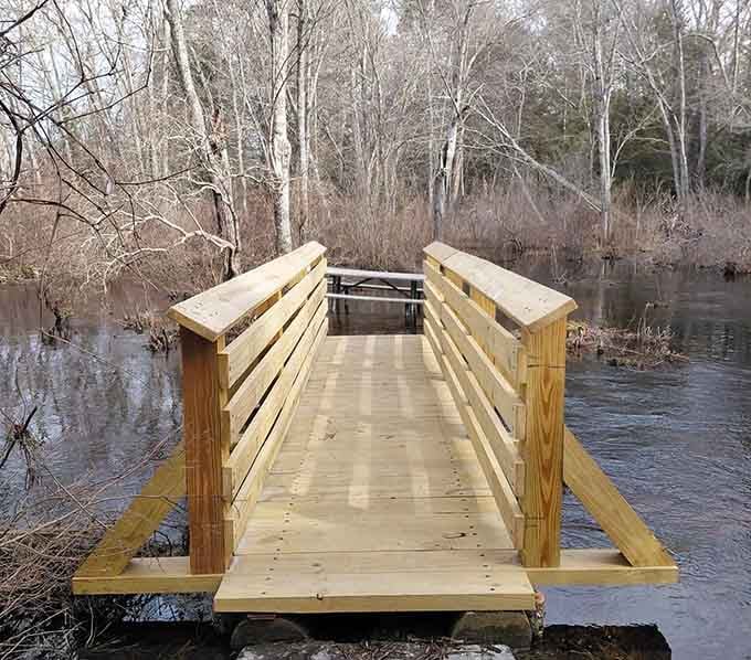 Fresh lumber, calm dark water, and bare winter trees, this Pachaug footbridge looks ready for its close-up right now.