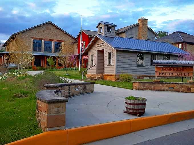 The Brown County History Center sits nestled among modern neighbors, bridging past and present with quiet dignity and springtime blooms.