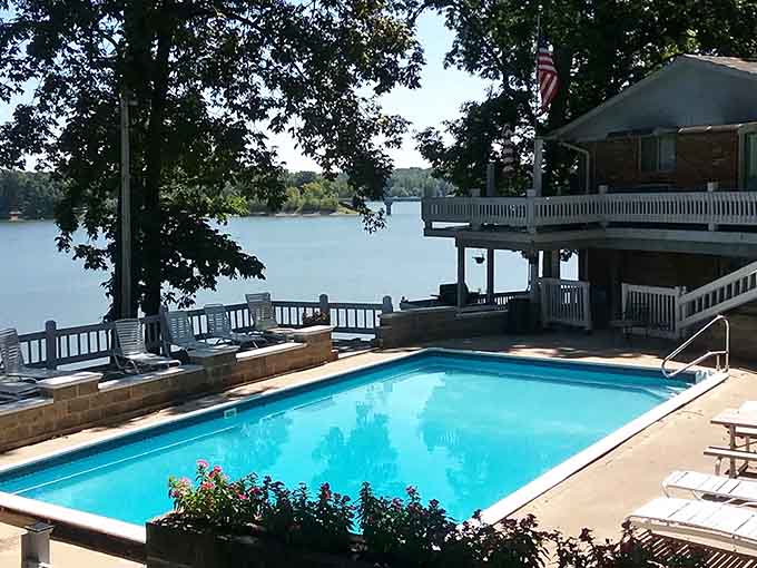 A sparkling pool, shady trees, and Raccoon Lake just beyond the deck &mdash; someone clearly planned this perfectly.