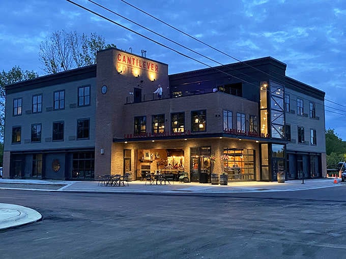 The Cantilever Hotel glows against the twilight sky, proof that small towns can pull off seriously big style.