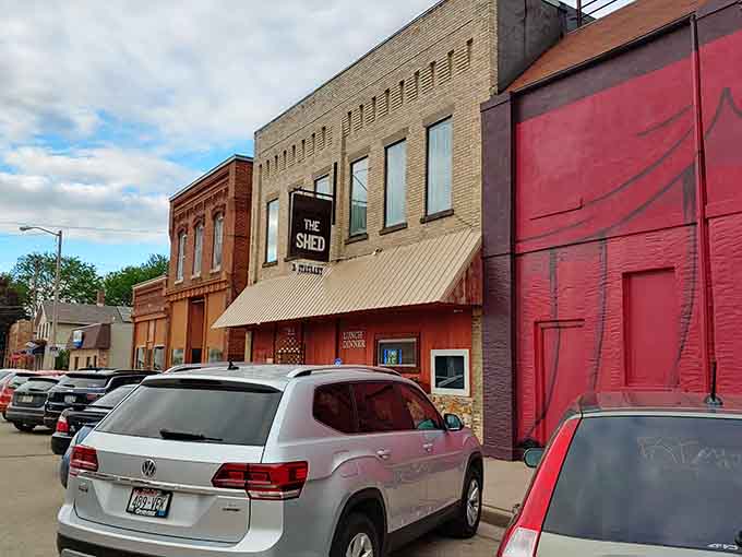 Historic buildings line up like old friends at a reunion, each storefront holding decades of stories behind those windows.