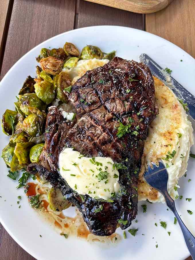That char-grilled Delmonico steak with Brussels sprouts looks like it could solve most of life's problems, or at least the dinner-related ones.