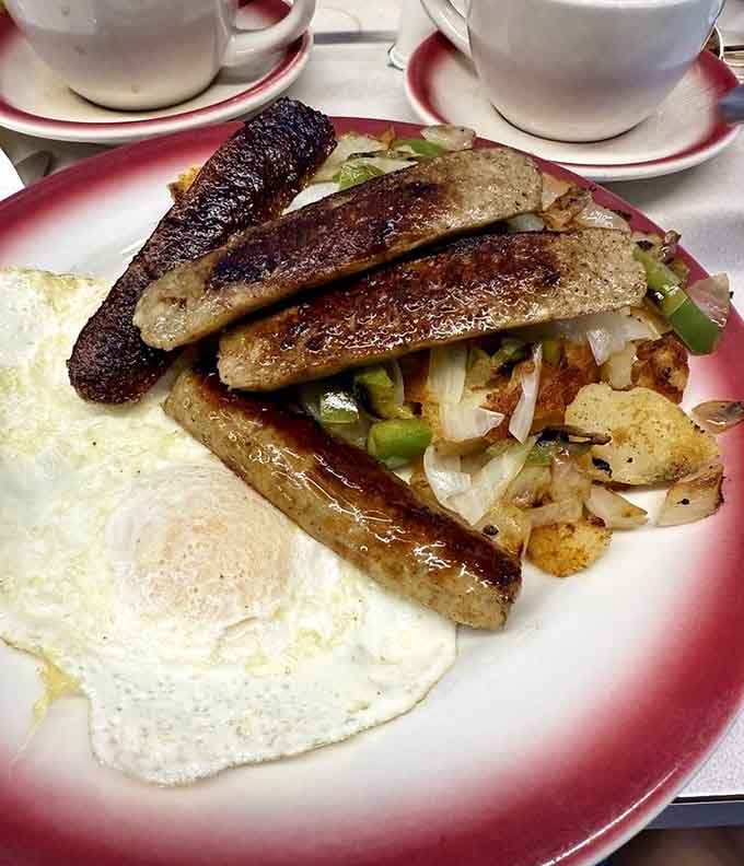 Crispy grilled sausage, golden home fries, and a fried egg, this plate means serious business from the very first bite.