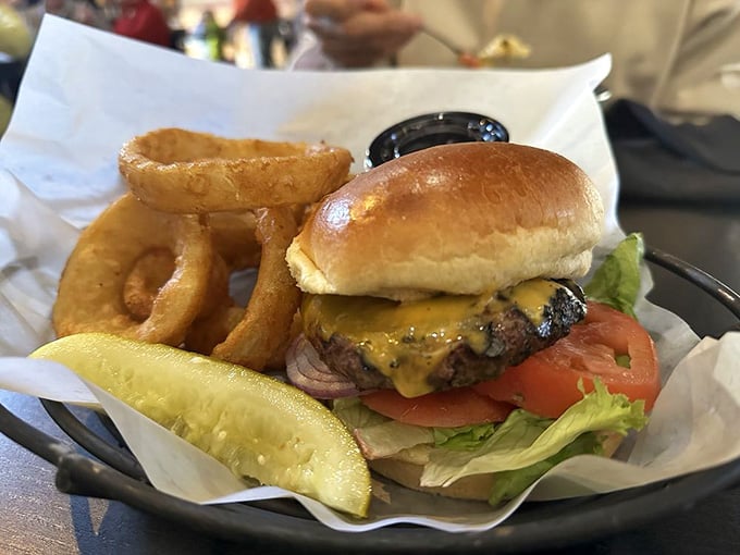 A proper cheeseburger with golden onion rings on the side &mdash; simple, honest, and absolutely no apologies necessary.