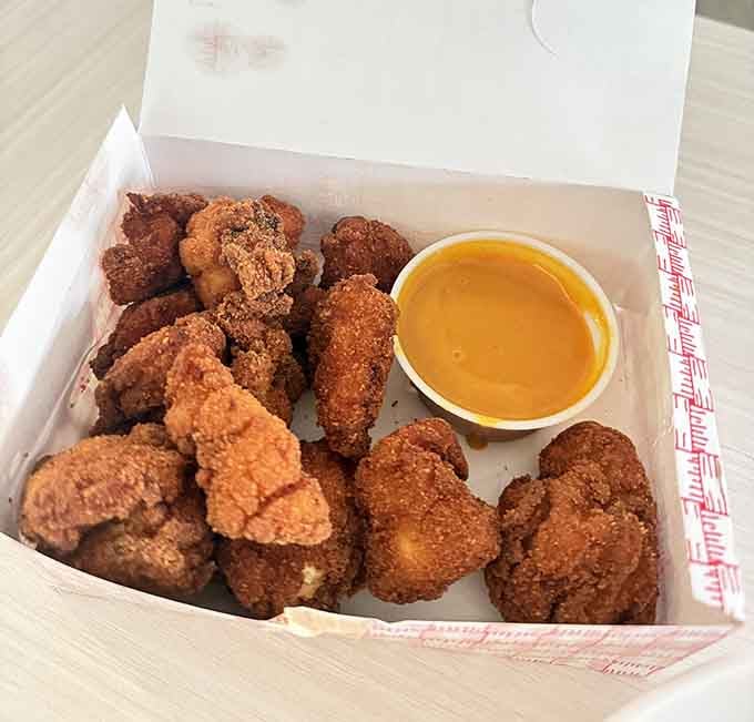 Golden, crispy, and piled high in a box, these chicken bites are the reason people keep coming back to Augusta's.