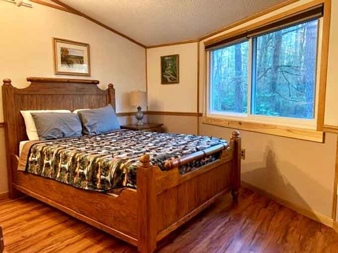 A solid wooden bed frame, forest views right outside the window, and zero alarm clocks required. Sleep well, friend.