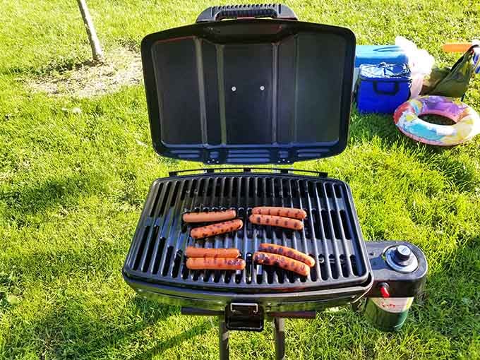 Nothing says summer like hot dogs sizzling on a portable grill with the lake as your backdrop.