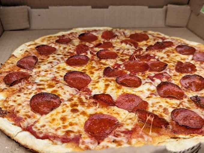 Crispy, golden, loaded with pepperoni, this pizza means serious business and pairs beautifully with a cold craft beer.
