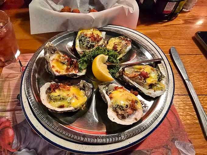 Oysters Rockefeller arrive bubbling with rich, buttery goodness that makes you forget about whatever diet starts Monday.