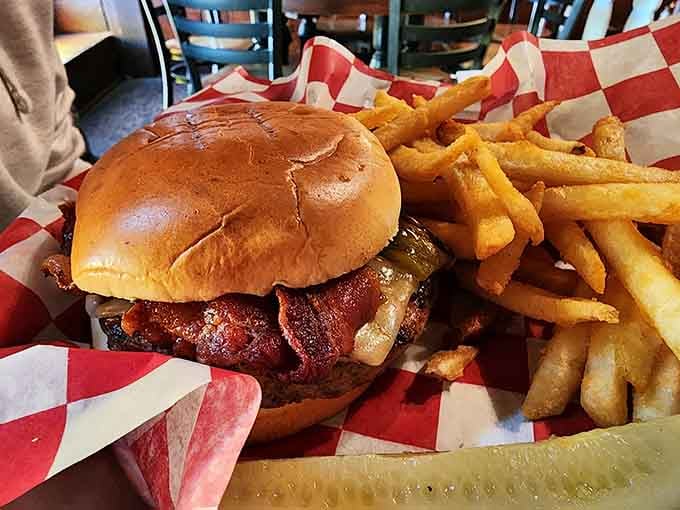 That bacon-loaded Angus burger sitting in a red-checked basket is the kind of lunch that makes afternoon plans disappear.