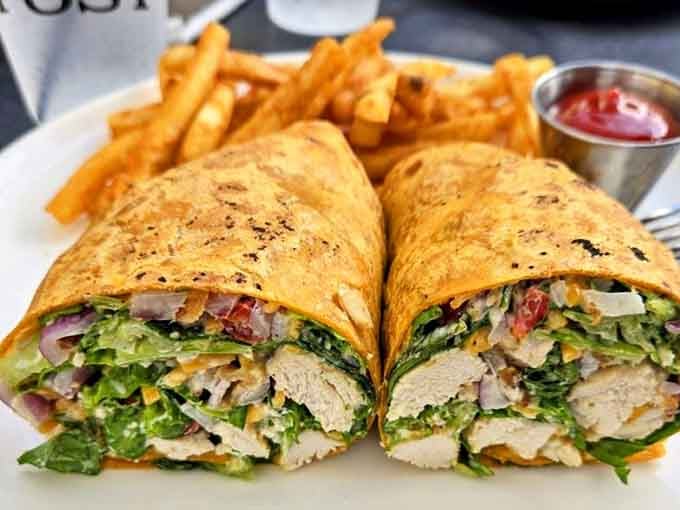 Crispy, golden, and stuffed to the edges. This chicken wrap arrives with fries and zero apologies.