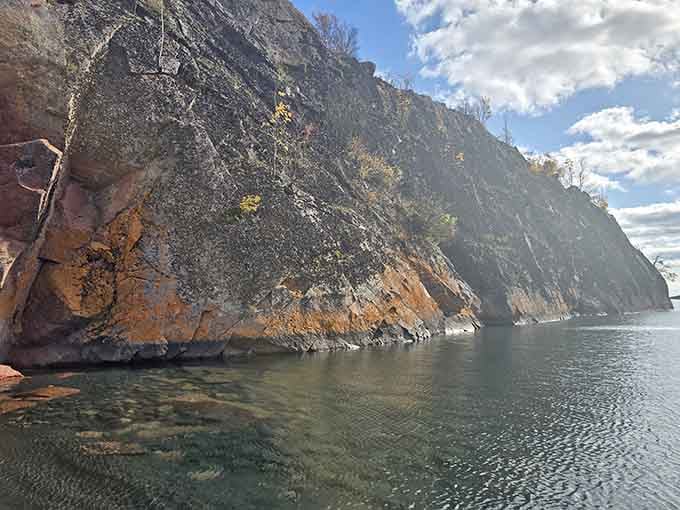 These rust-streaked cliffs have been standing since before dinosaurs, and they're still absolutely stealing the show.